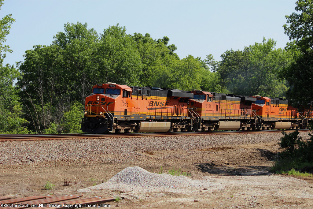 BNSF 7599 leads a wb stack train.